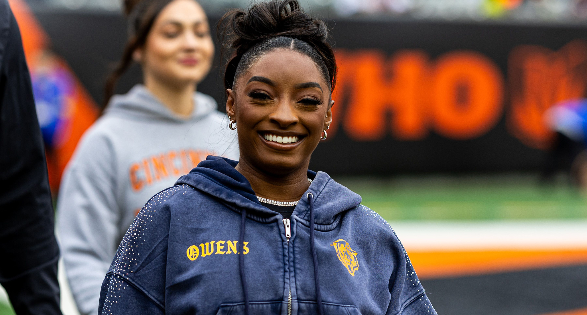 Simone Biles has a cute PDA moment with her husband - but OMG, that coat