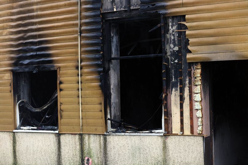 Heavy emergency services presence as fire wrecks building