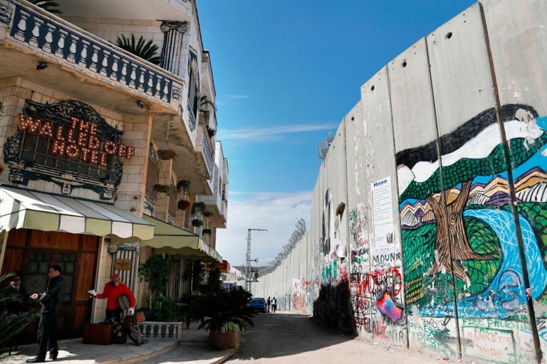 Banksy's Walled Off Hotel in Bethlehem reopens for the first time since ...