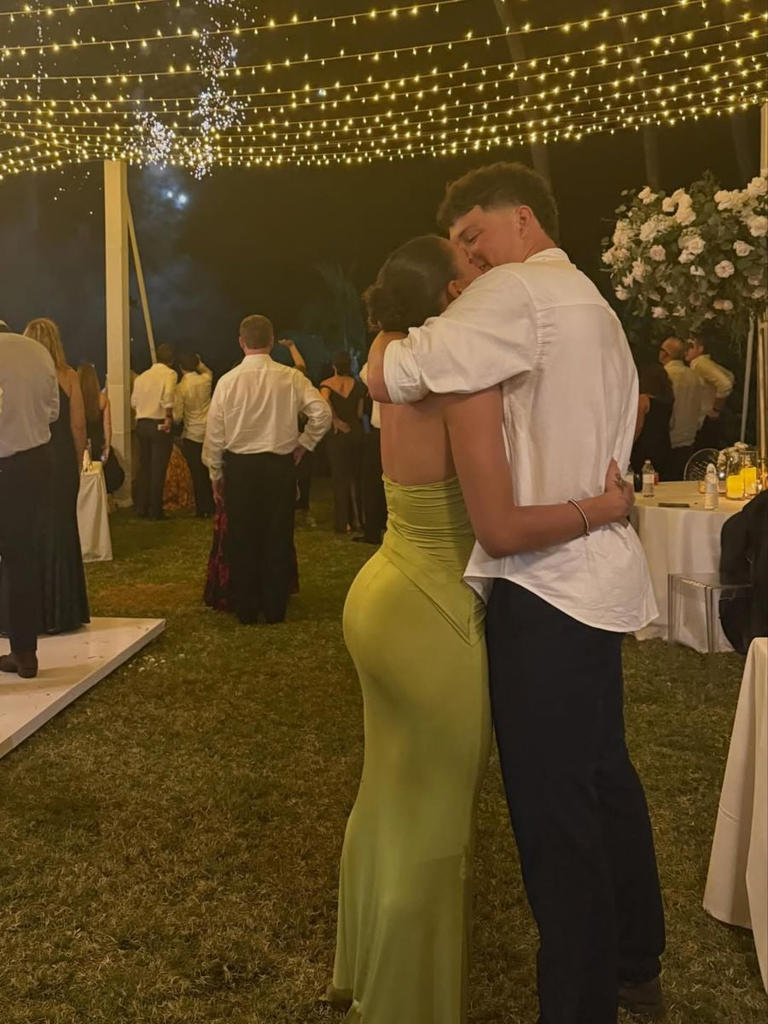 Trinity Rodman and Ben Shelton share a sweet kiss at a friend's wedding