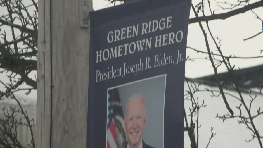 Residents voice opinion in former President Biden’s banner