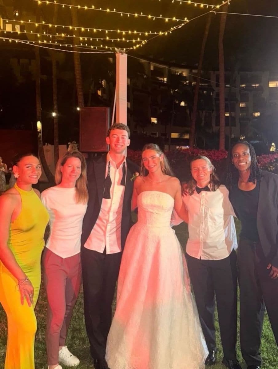 Trinity Rodman and Ben Shelton share a sweet kiss at a friend's wedding
