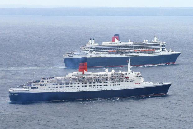 Thousands watched as ocean liners QE2 and QM2 arrived together for ...