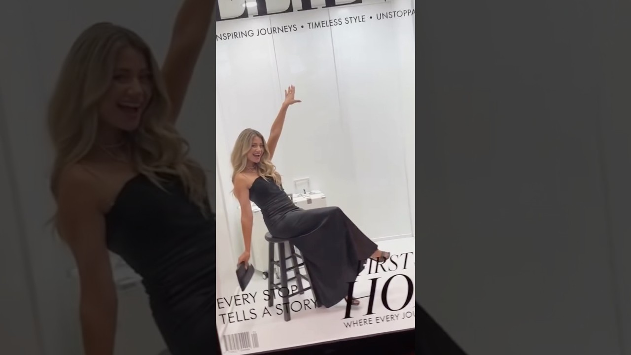 Mom poses like she's on a magazine cover at fun event photo op