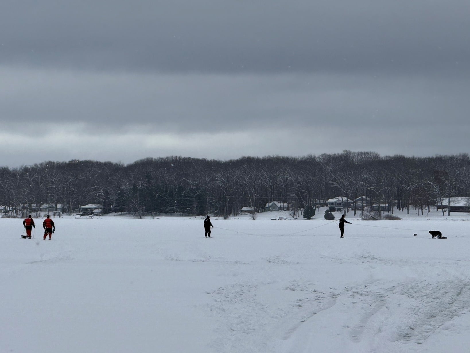 Two dead after snowmobiles fall through ice in Mason County