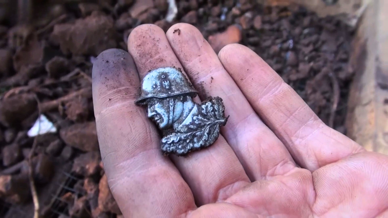 A massive WWII dump site reveals dozens of forgotten badges and relics