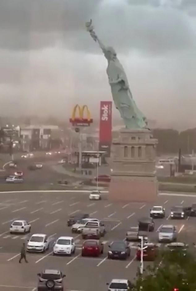 110ft Statue of Liberty replica comes crashing down as huge winds hit ...