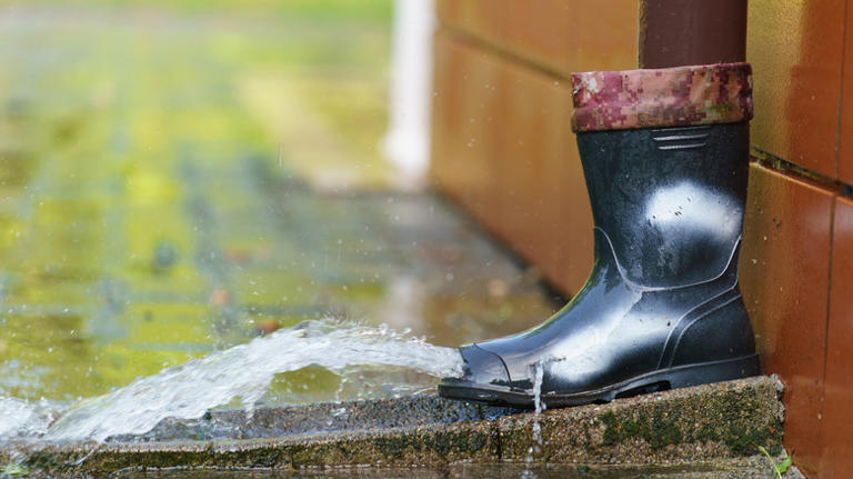 The fun & clever old shoe hack that helps your downspout drain properly