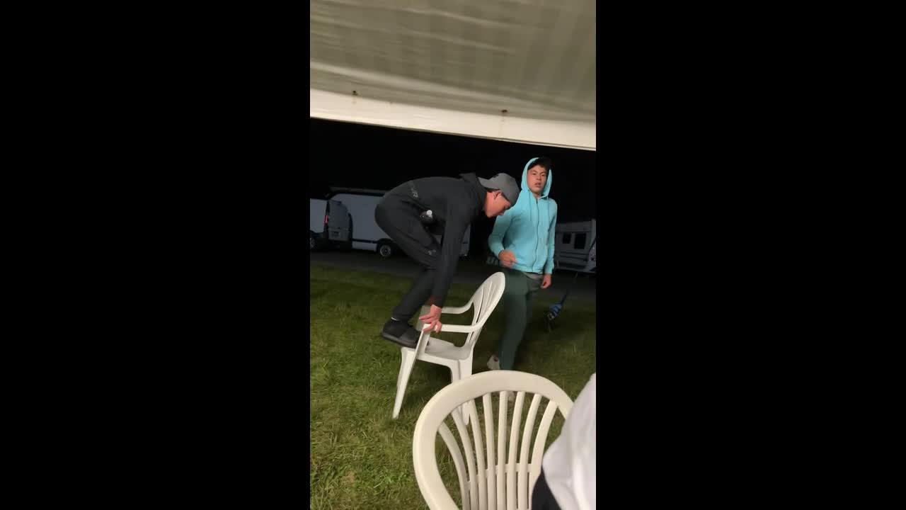 Man trips while attempting a jump over a plastic chair in Voiron, France