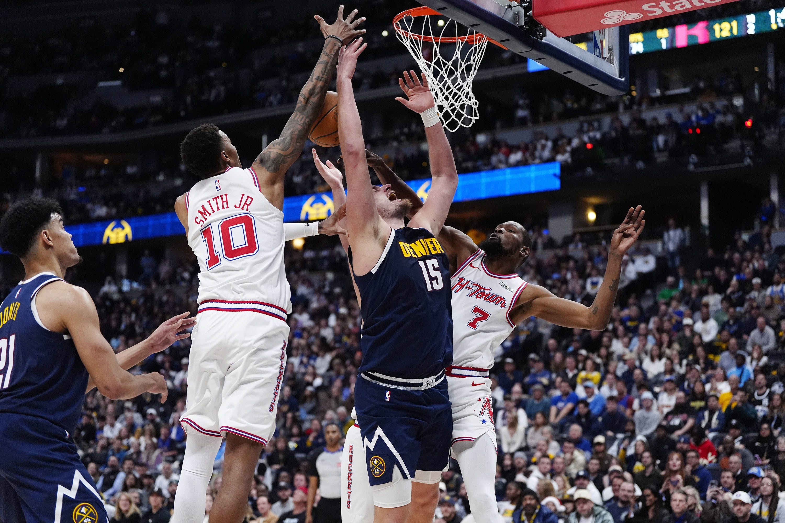NBA: In close loss at Denver, Rockets hurt by three missed calls late