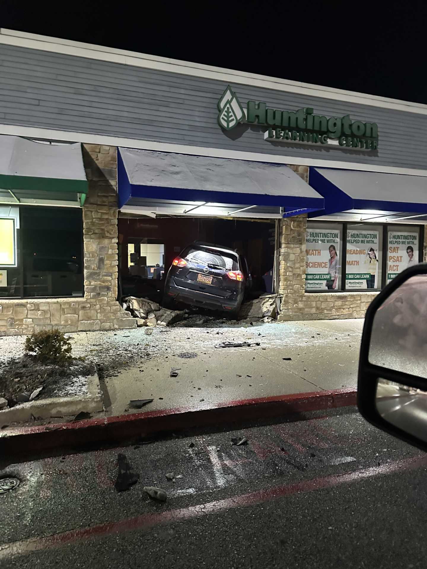 Vehicle barrels into learning center | Police find person associated ...