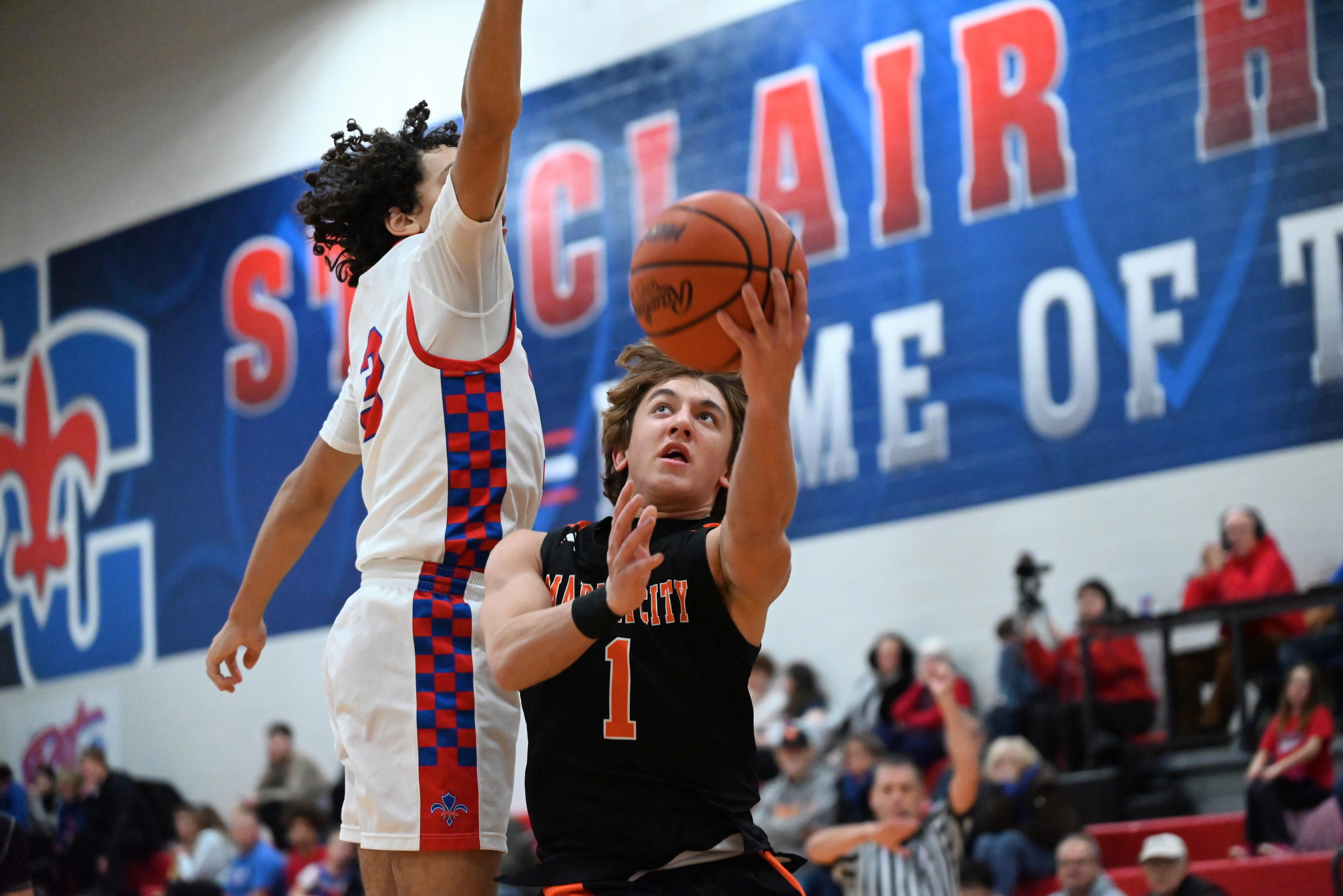 Marine City boys basketball outlasts rival Marysville in overtime