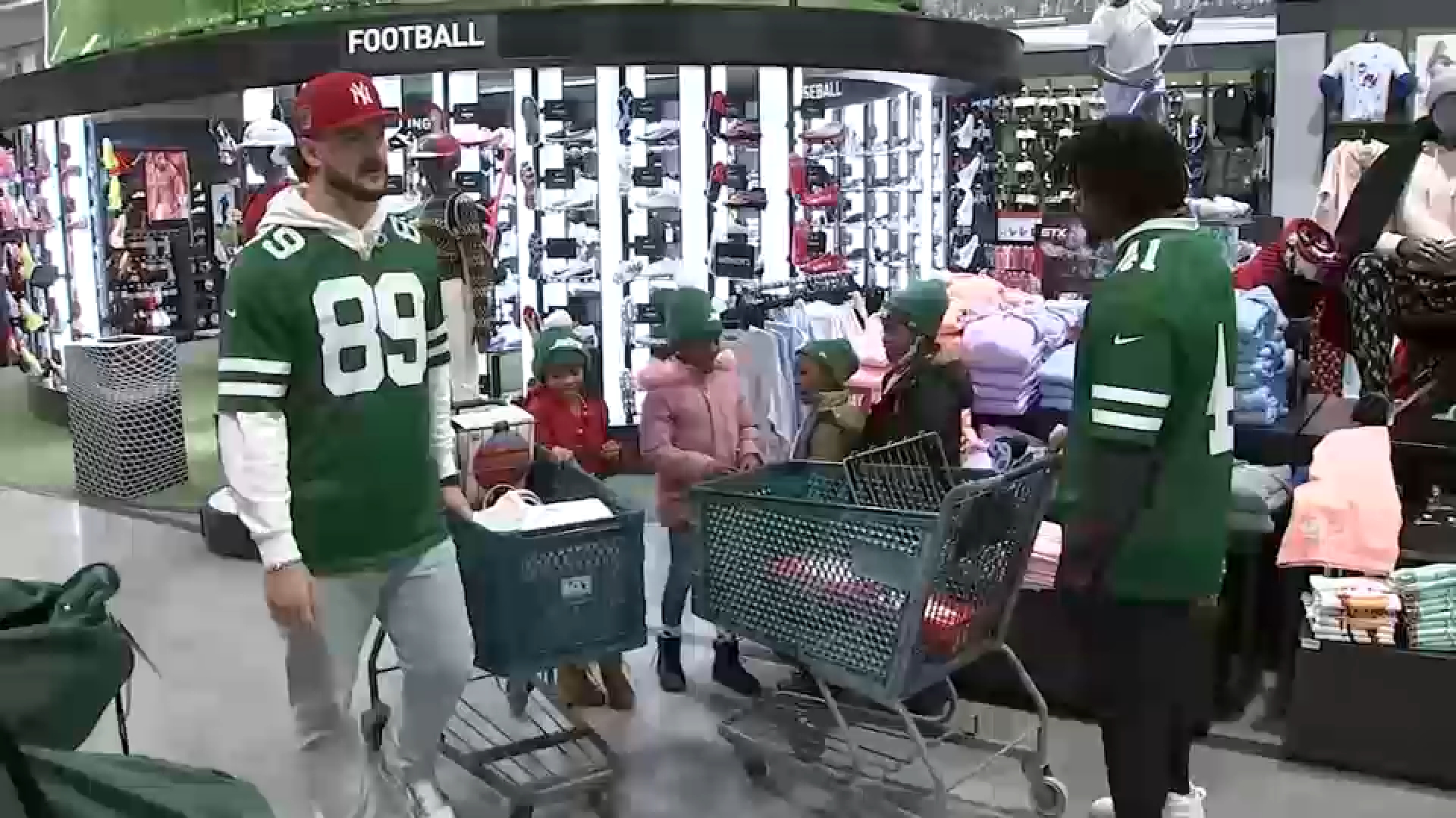 Jets players throw holiday shopping spree for kids at Dick's Sporting ...