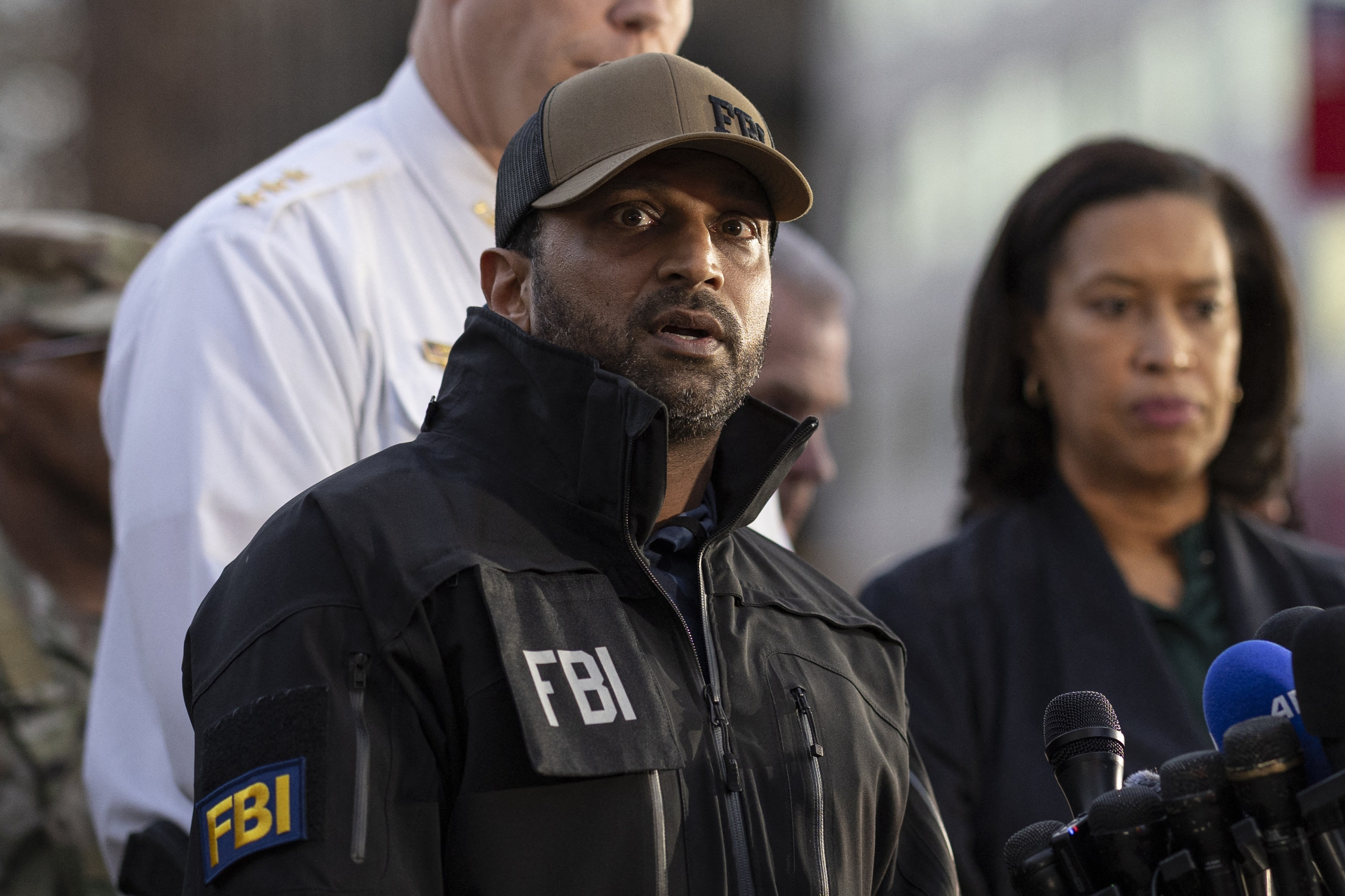 Former FBI agents sue director