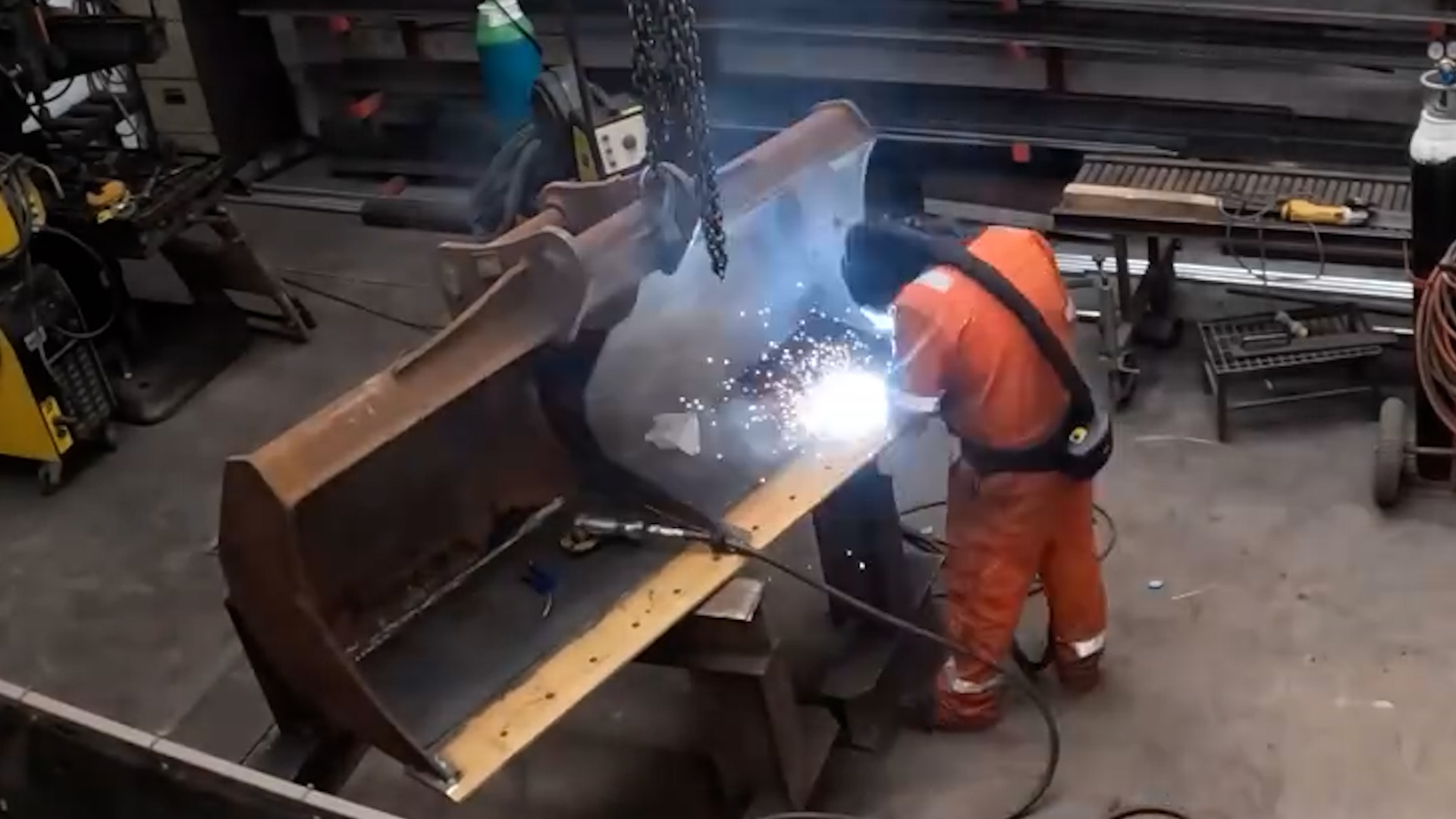 Welding a damaged excavator bucket