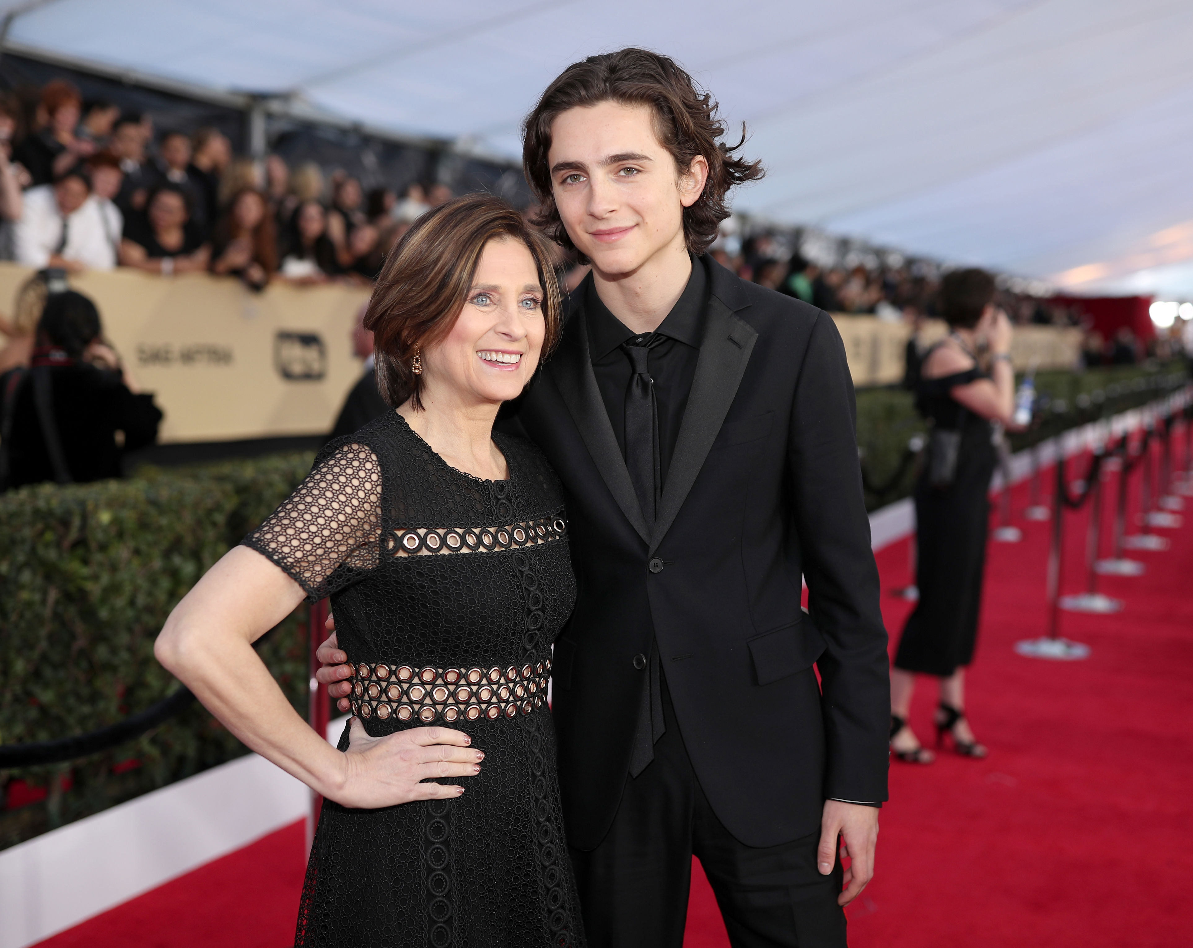 Timothée Chalamet and his mom match in 'Marty Supreme' orange on NYC ...