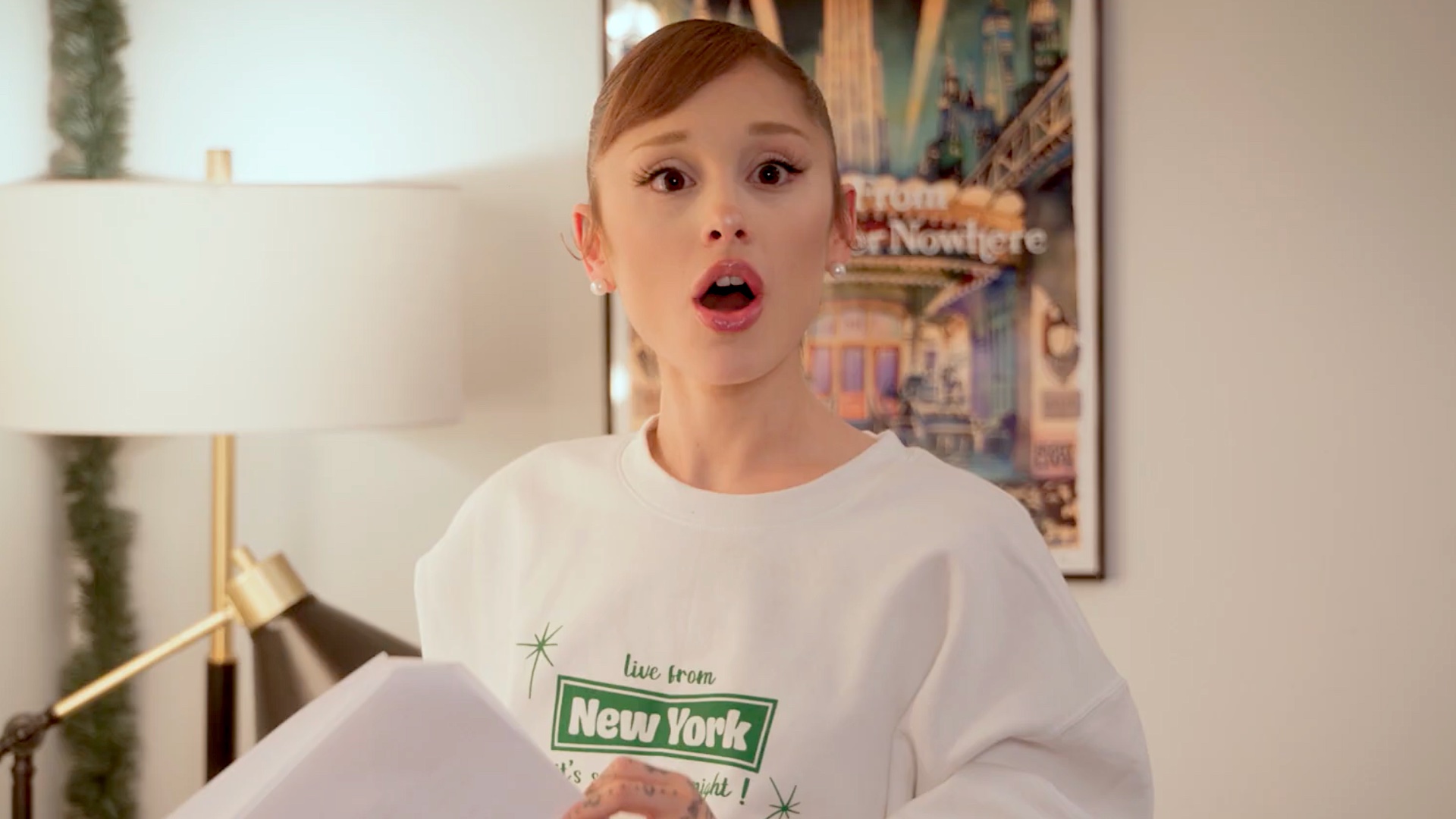 SNL host Ariana Grande layers up ahead of a chilly Rockefeller tree visit
