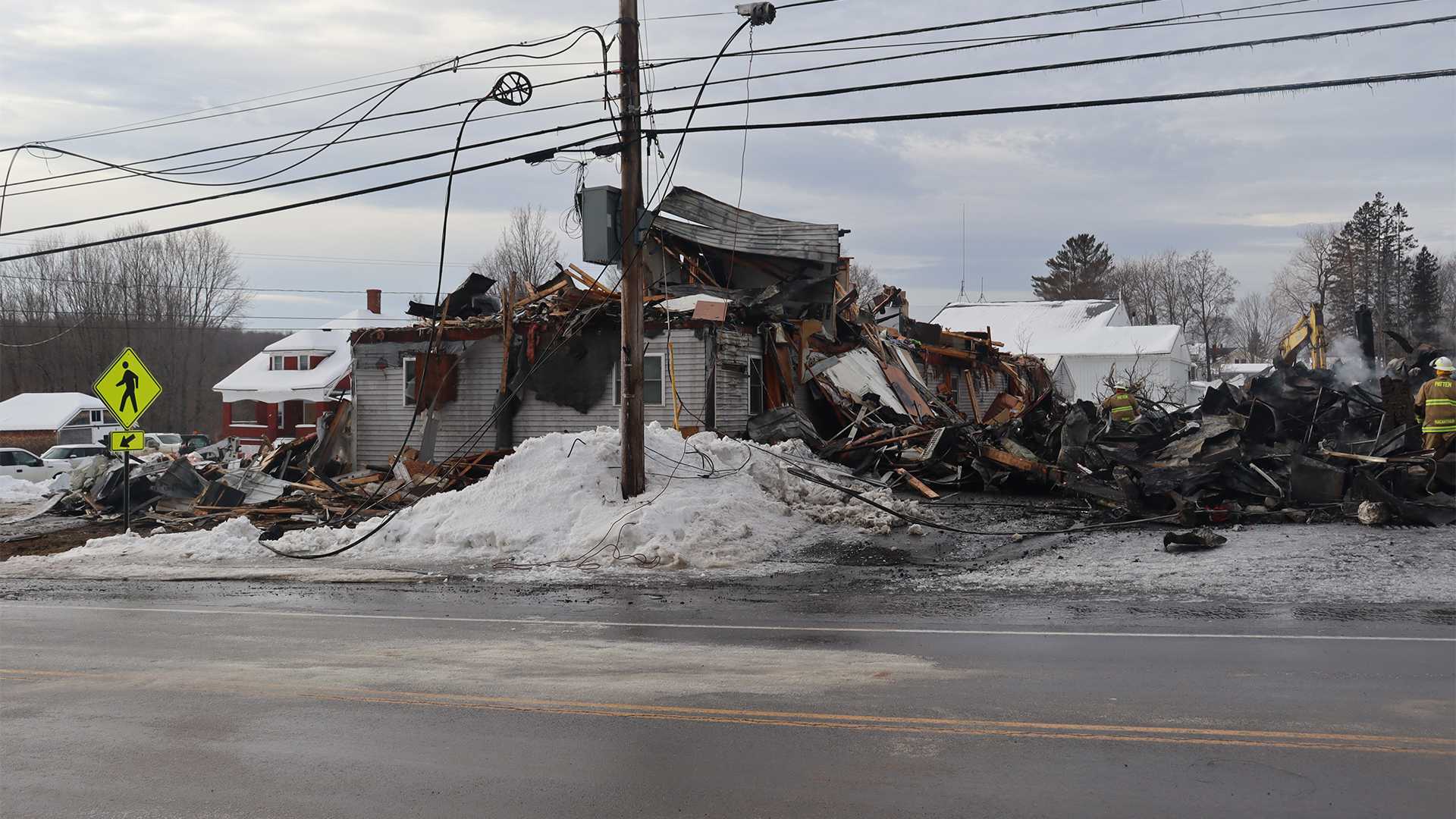 Fire destroys Maine auto repair shop, damages nearby apartment building