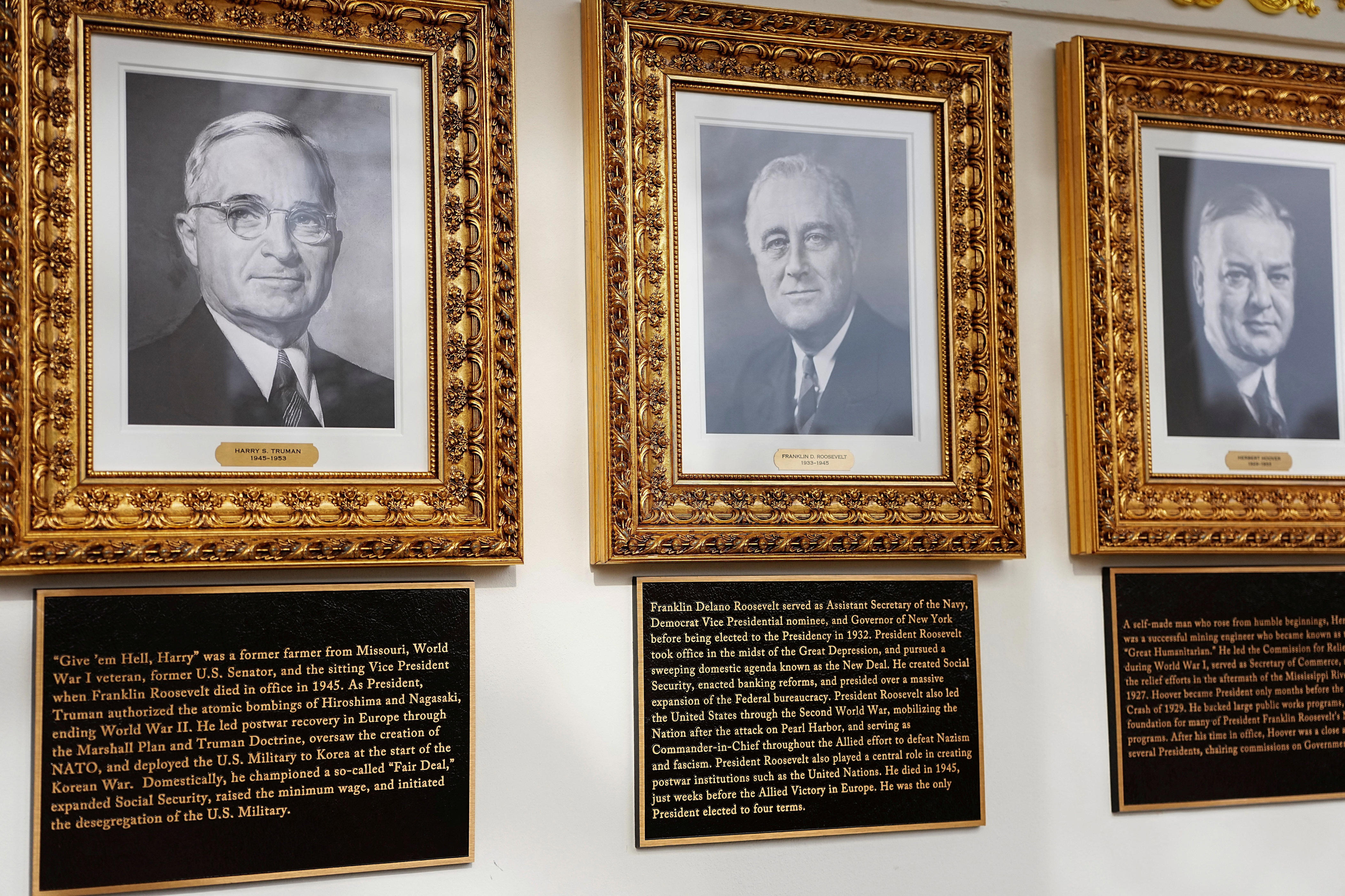 Trump unveils presidential plaques. What does Iowan Herbert Hoover's say?