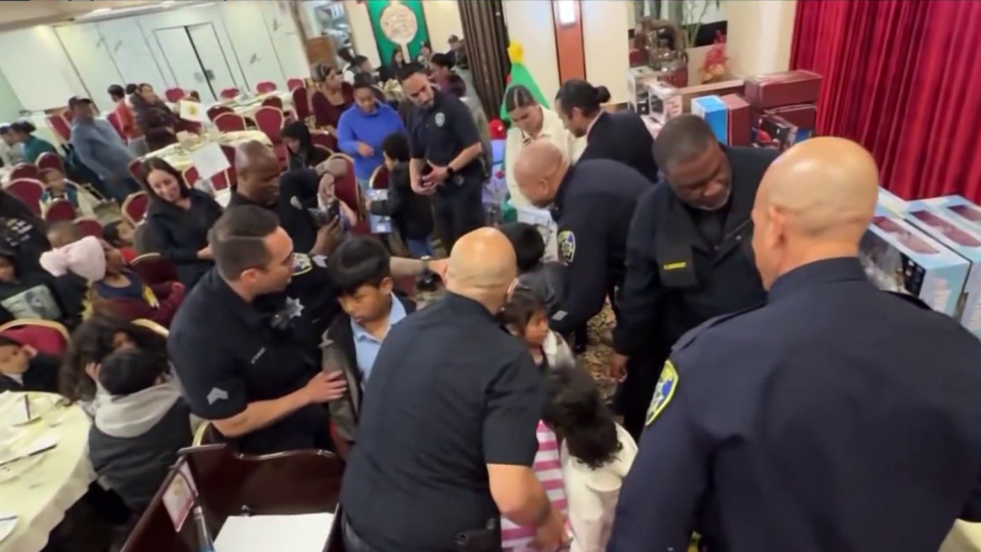 Oakland PD hands out gifts to over 100 children
