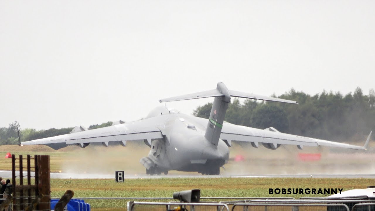 Watch a massive military jet power through rain at takeoff