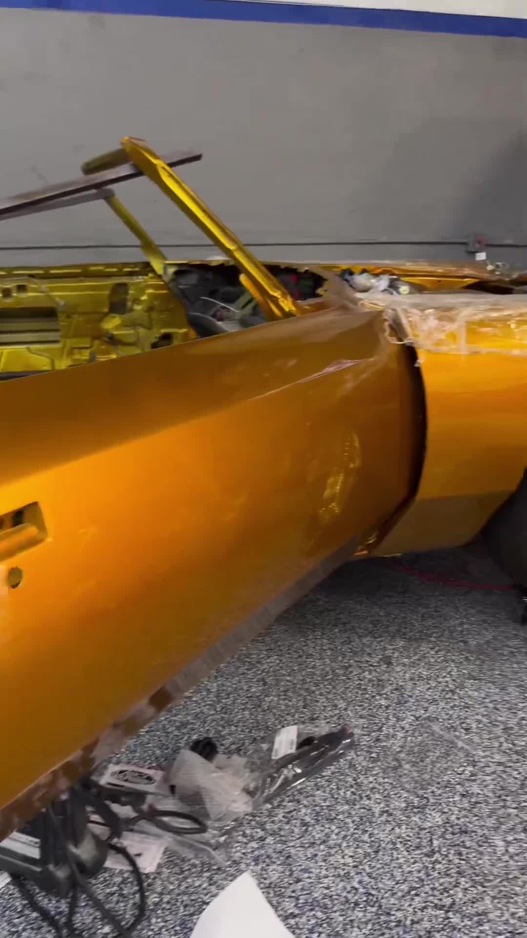 Candy gold Chevy on gold 24’s Daytons in the lab at Blue-Magic Built