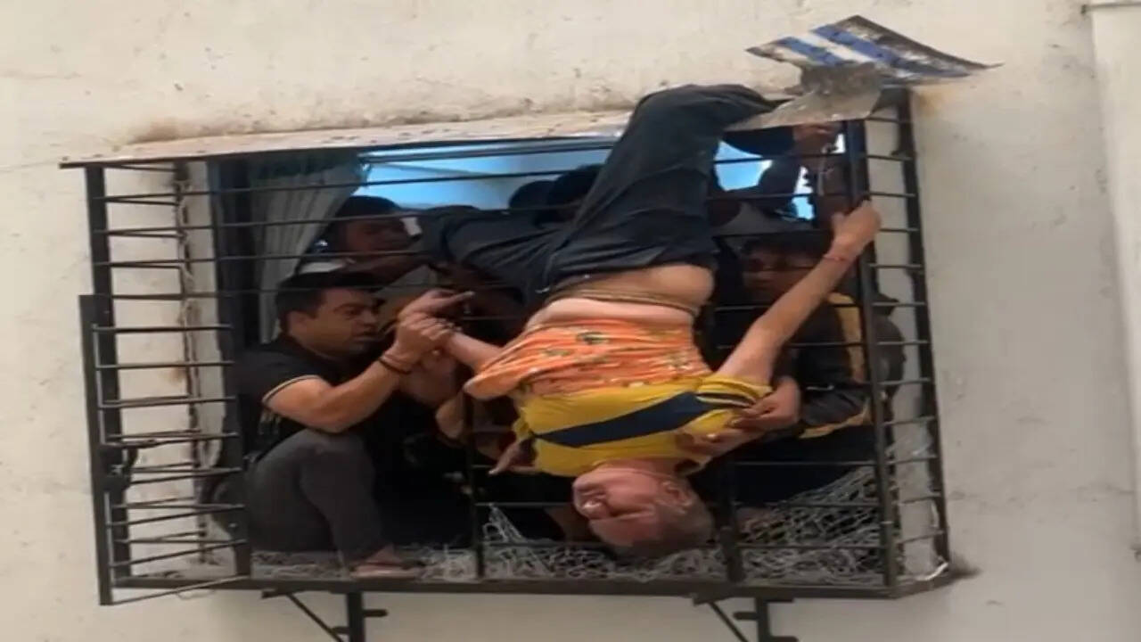 Surat man survives 10th-floor fall after hanging on window grill for an ...