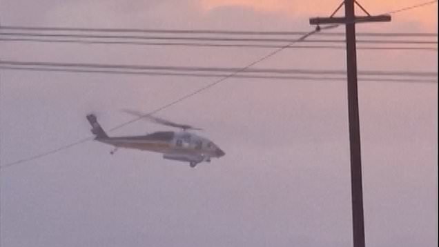 Dramatic footage shows helicopter airlifting people to safety amid ...
