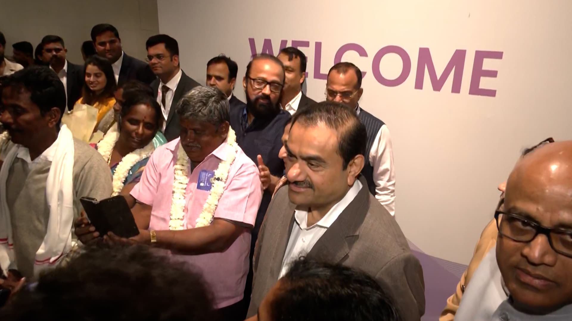 Gautam Adani greets passengers as first flight lands at Navi Mumbai Airport