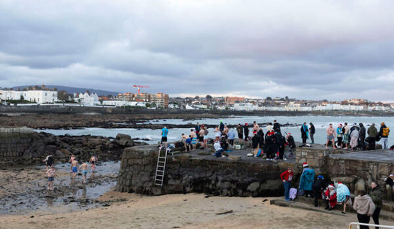 Chilly swimmers brave the icy waters for annual Christmas Day plunge