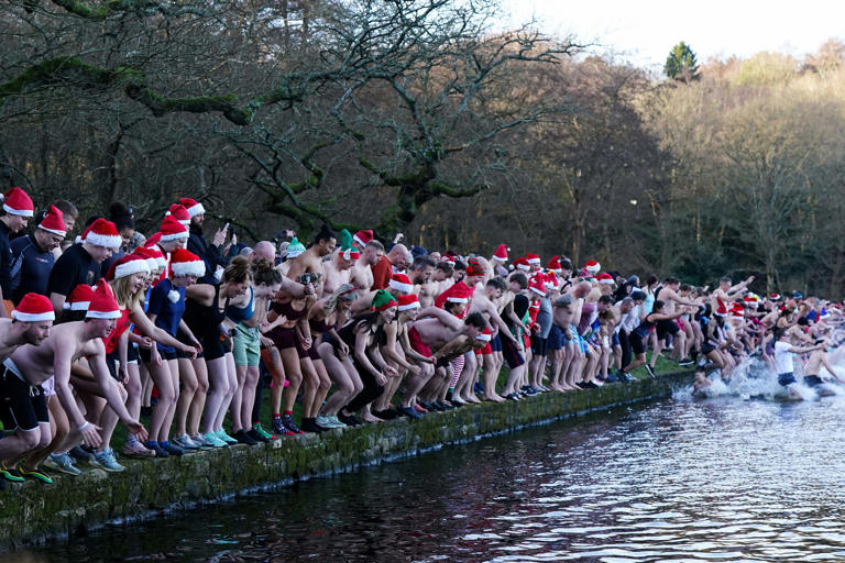 In pictures: Hardy swimmers and royal watchers brave cold Christmas Day