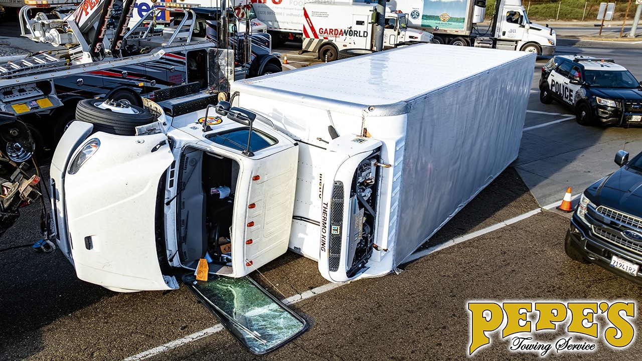 Box Truck Rolls Over Through Busy Intersection!