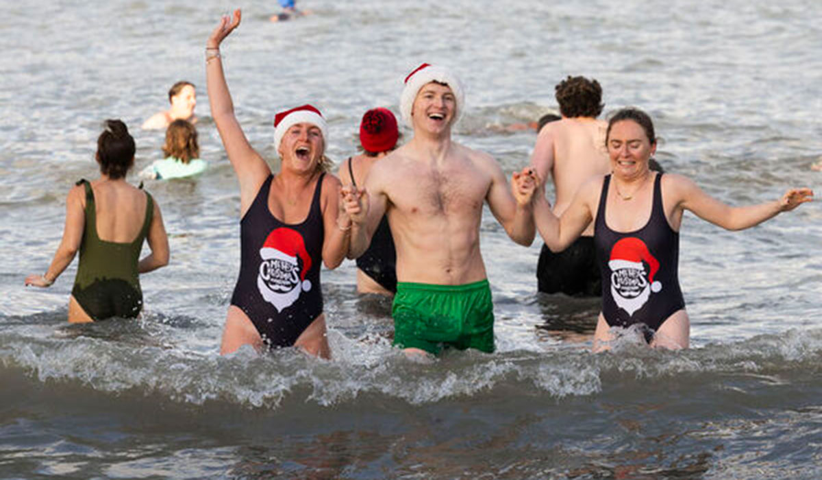 Chilly swimmers brave the icy waters for annual Christmas Day plunge