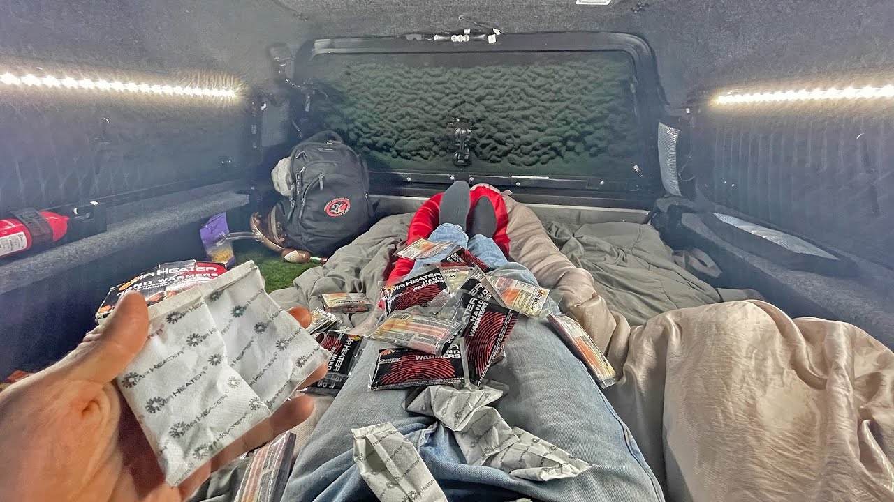 Winter truck camping using hand warmers for heat