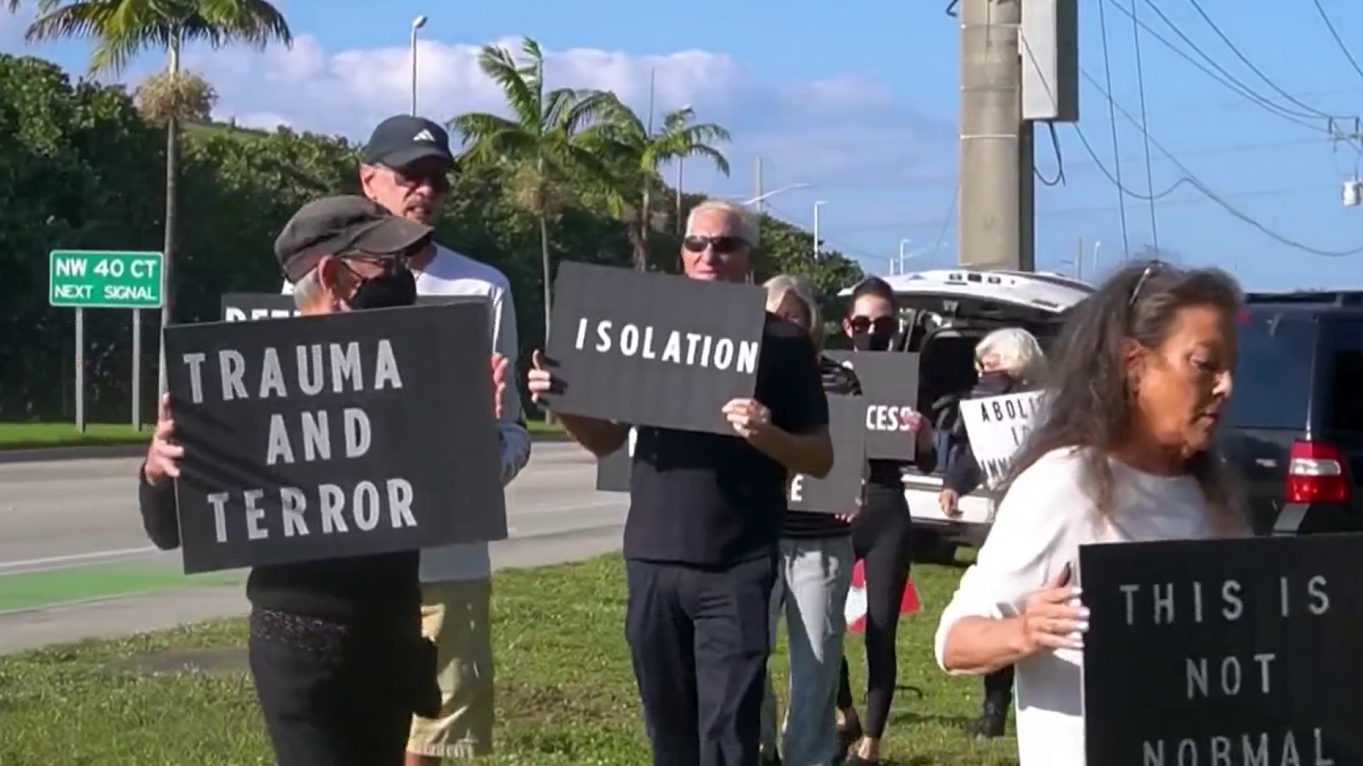 Protestors gather outside migrant detention center in Deerfield Beach ...