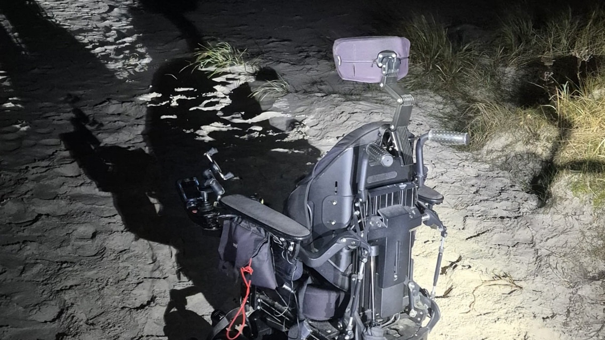 Woman rescued after wheelchair sinks in beach sand