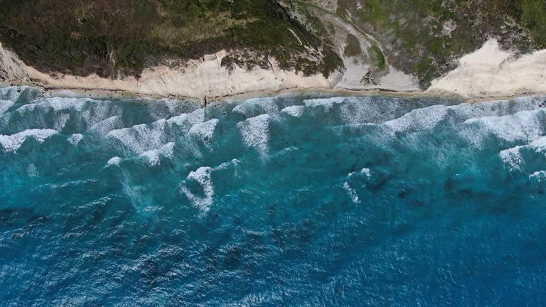 Two men remain missing after Christmas swim