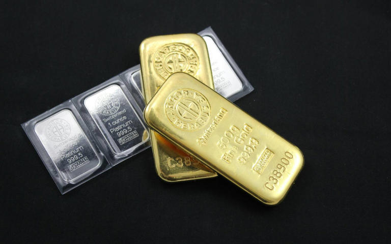 Silver rises to record, gold nears all-time high as risks persist