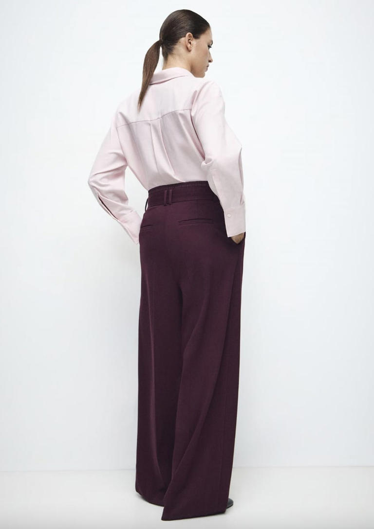 Mango's 2-in-1 burgundy trousers feature the trending waistband detail ...