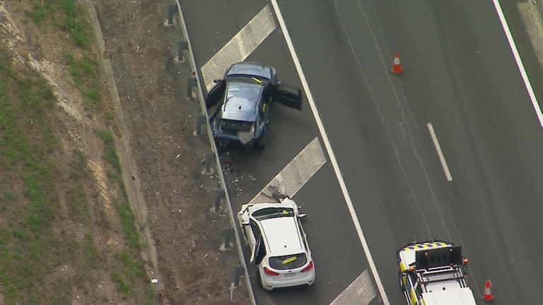 Man fighting for life after being hit while stopped on Queensland motorway
