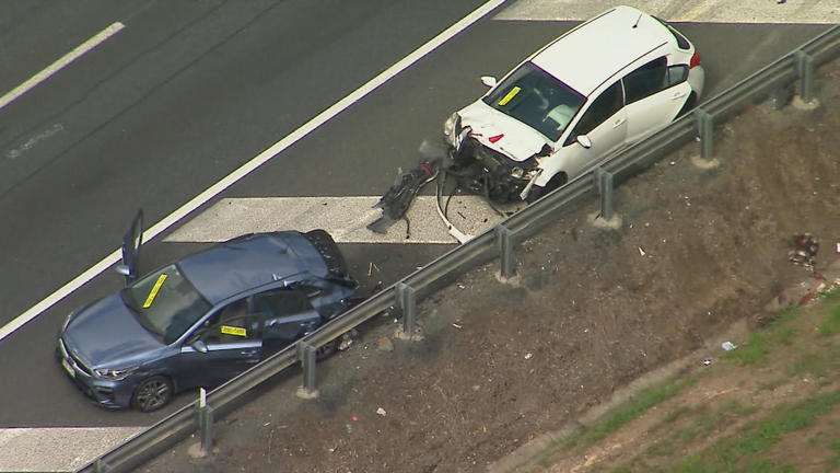 Man fighting for life after being hit while stopped on Queensland motorway