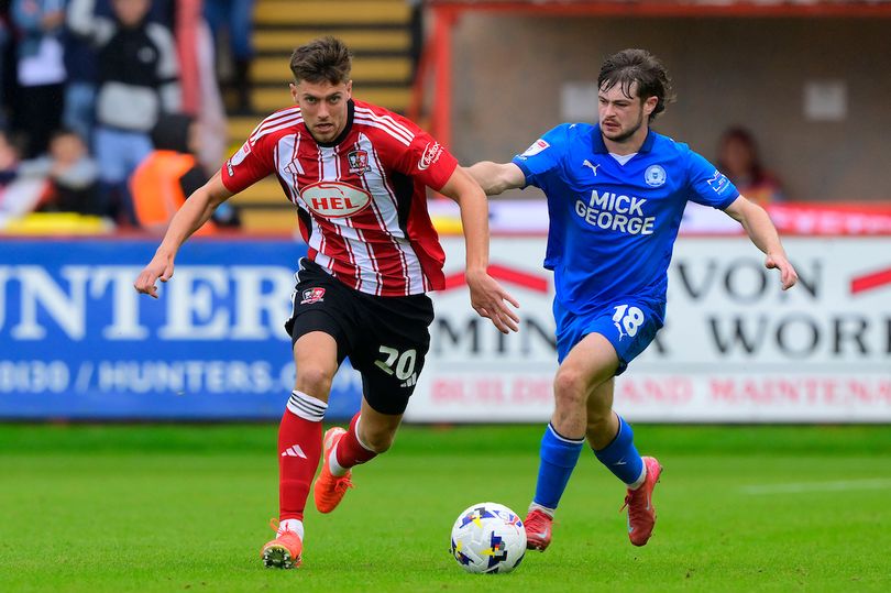 Exeter City's young centre-backs learning from Gary Caldwell's experience