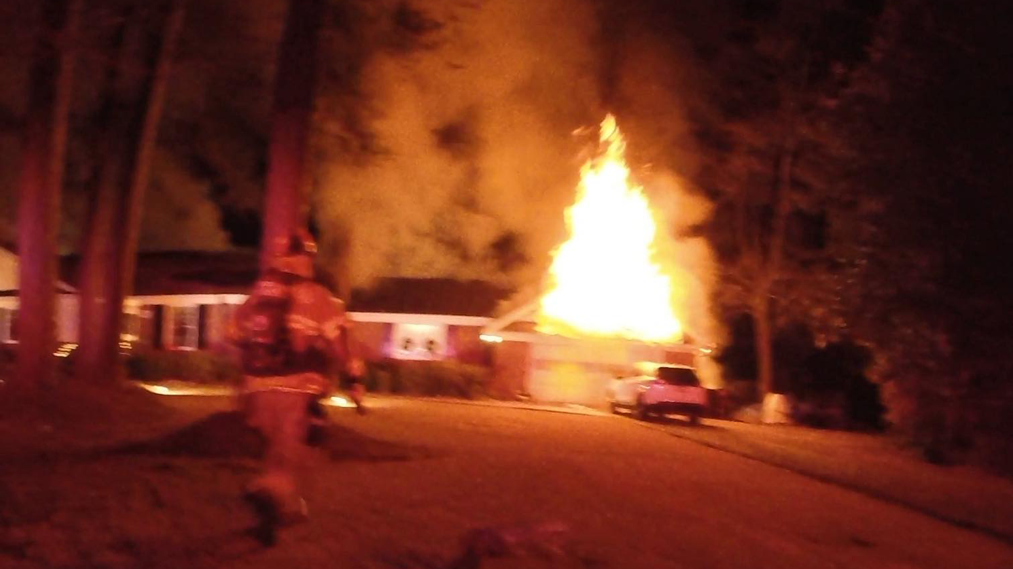 Crews contain house fire after blaze starts in attached garage