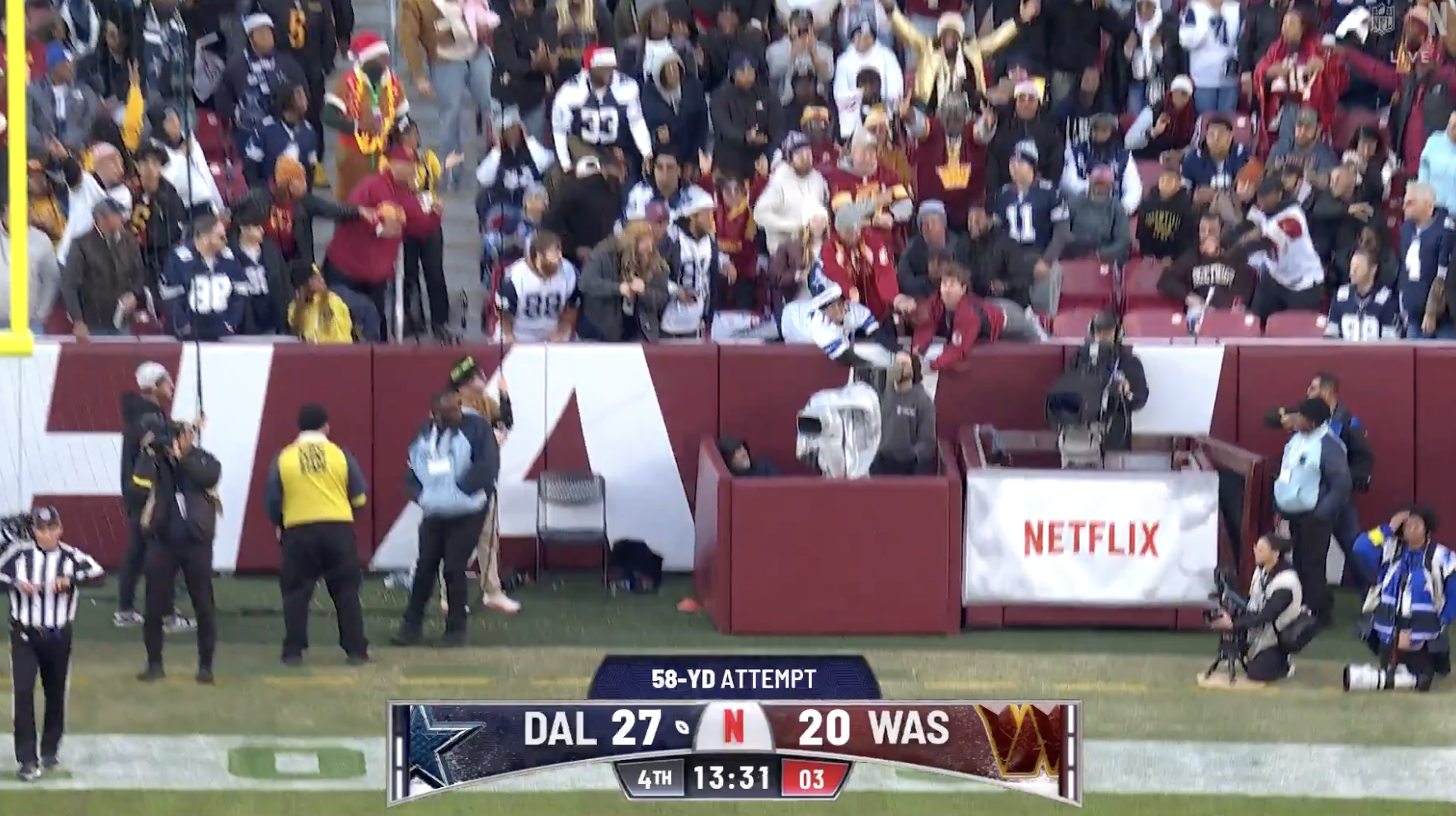 Unsuspecting cameraman doinked by missed field goal