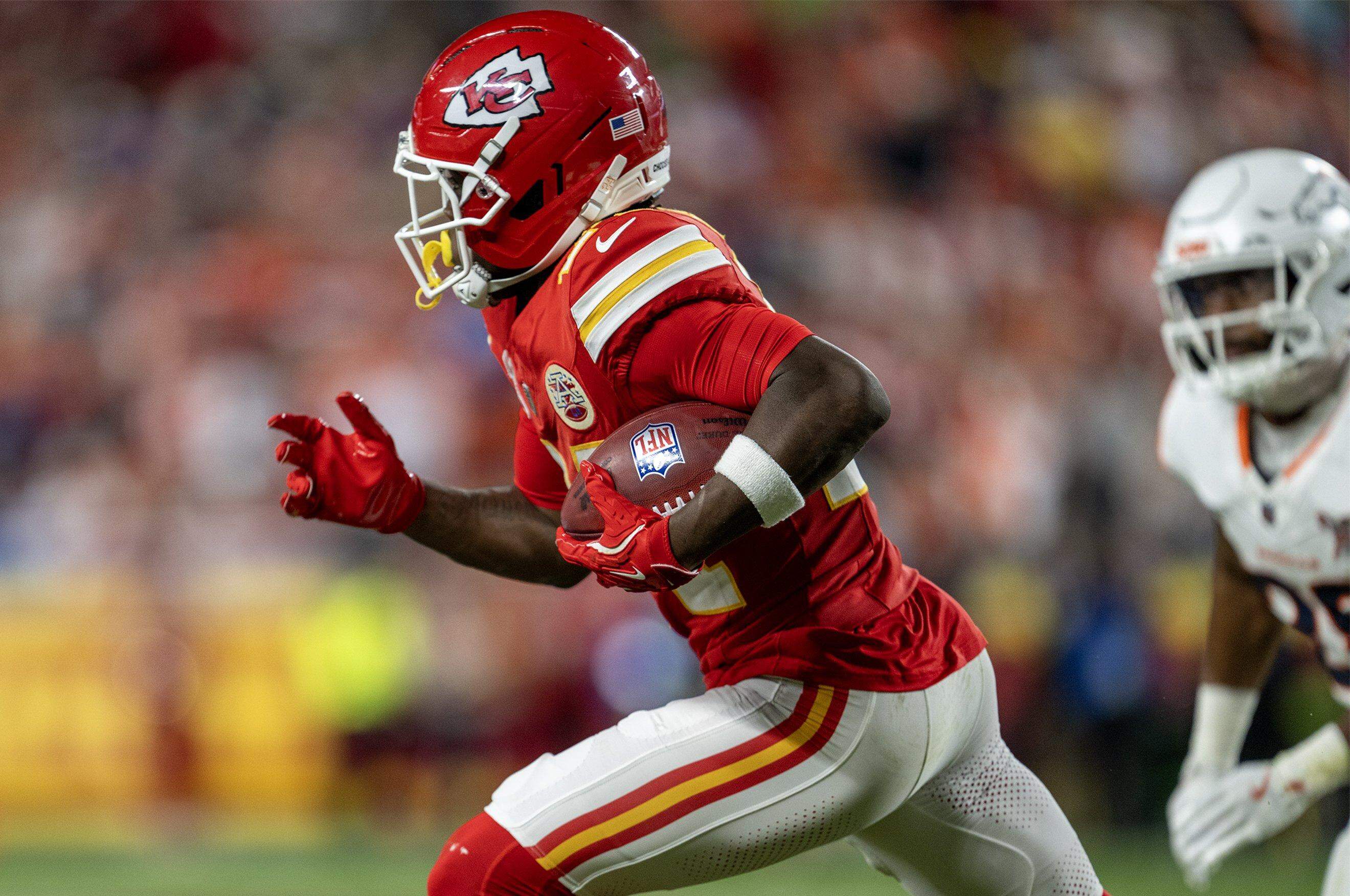 One play, two first NFL touchdowns - and a football split in half by ...