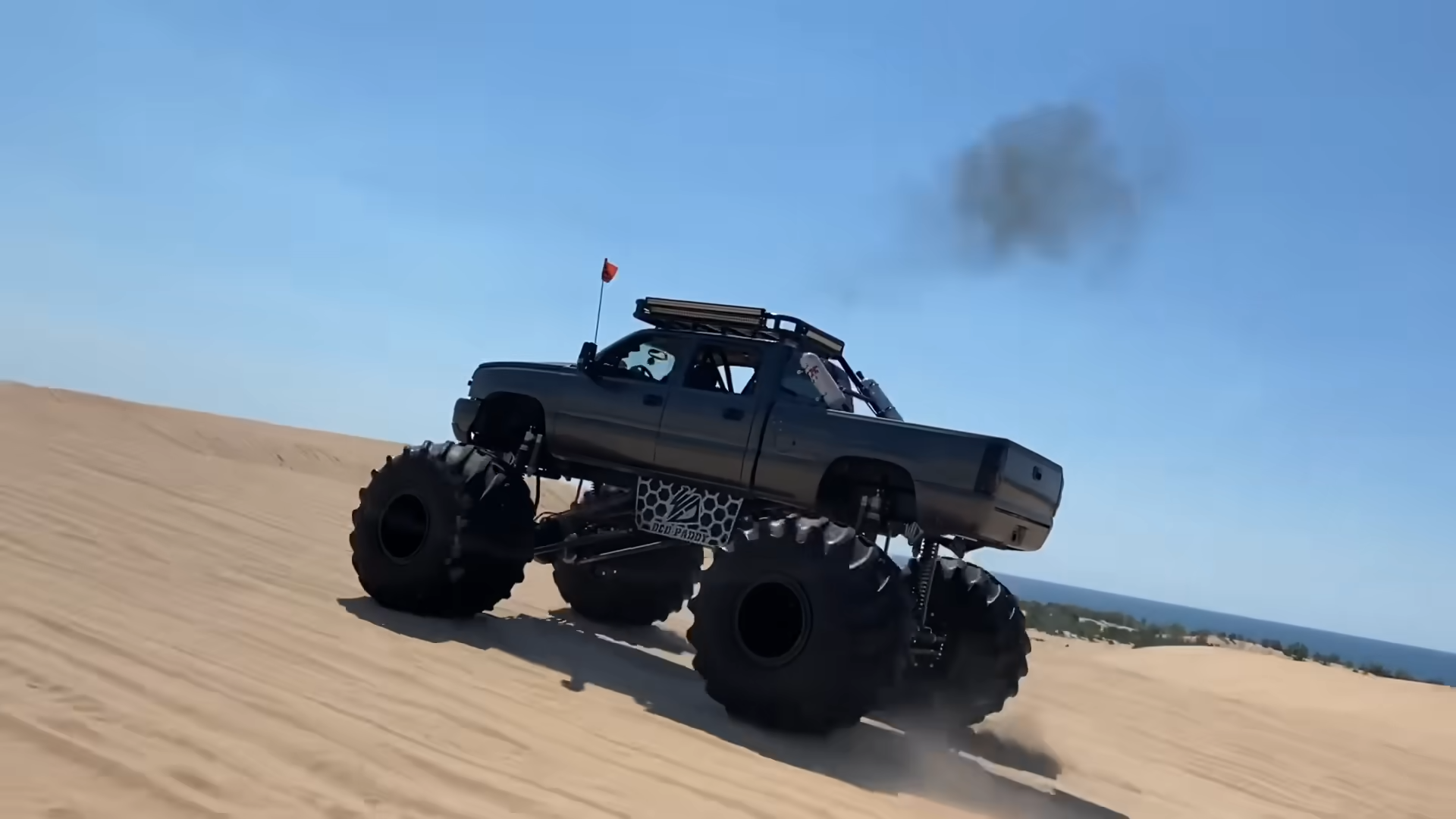 Monster truck tries climbing a 200-foot dune - it doesn’t go as planned