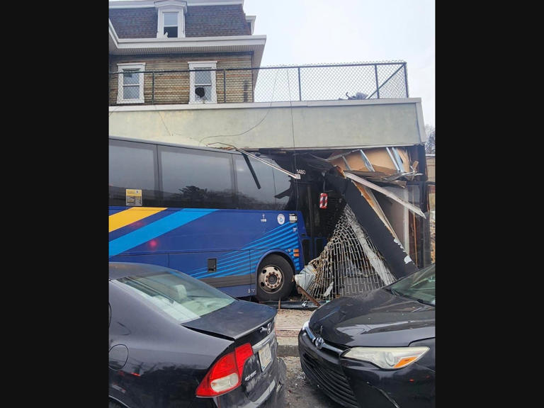 MTA bus crashes into storefront, parked cars in Yonkers