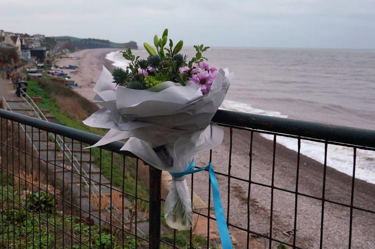 Floral tributes left at scene of tragic Christmas Day swim