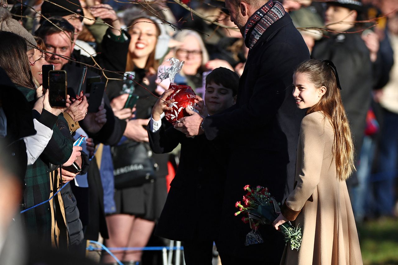 Princess Charlotte, 10, stops for a selfie during royal Christmas walk ...