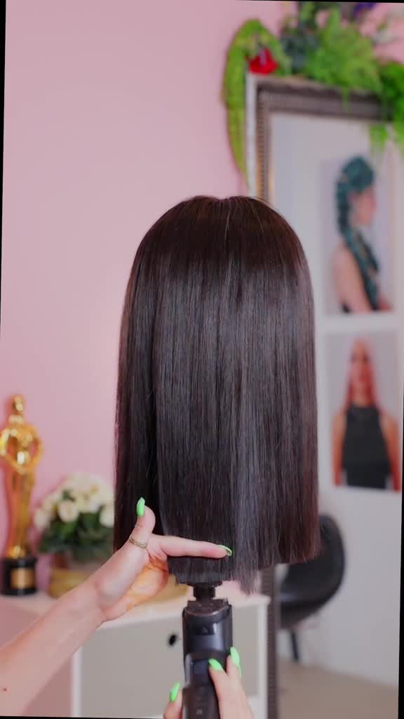 Satisfying one length clipper cut on sleek dark bob